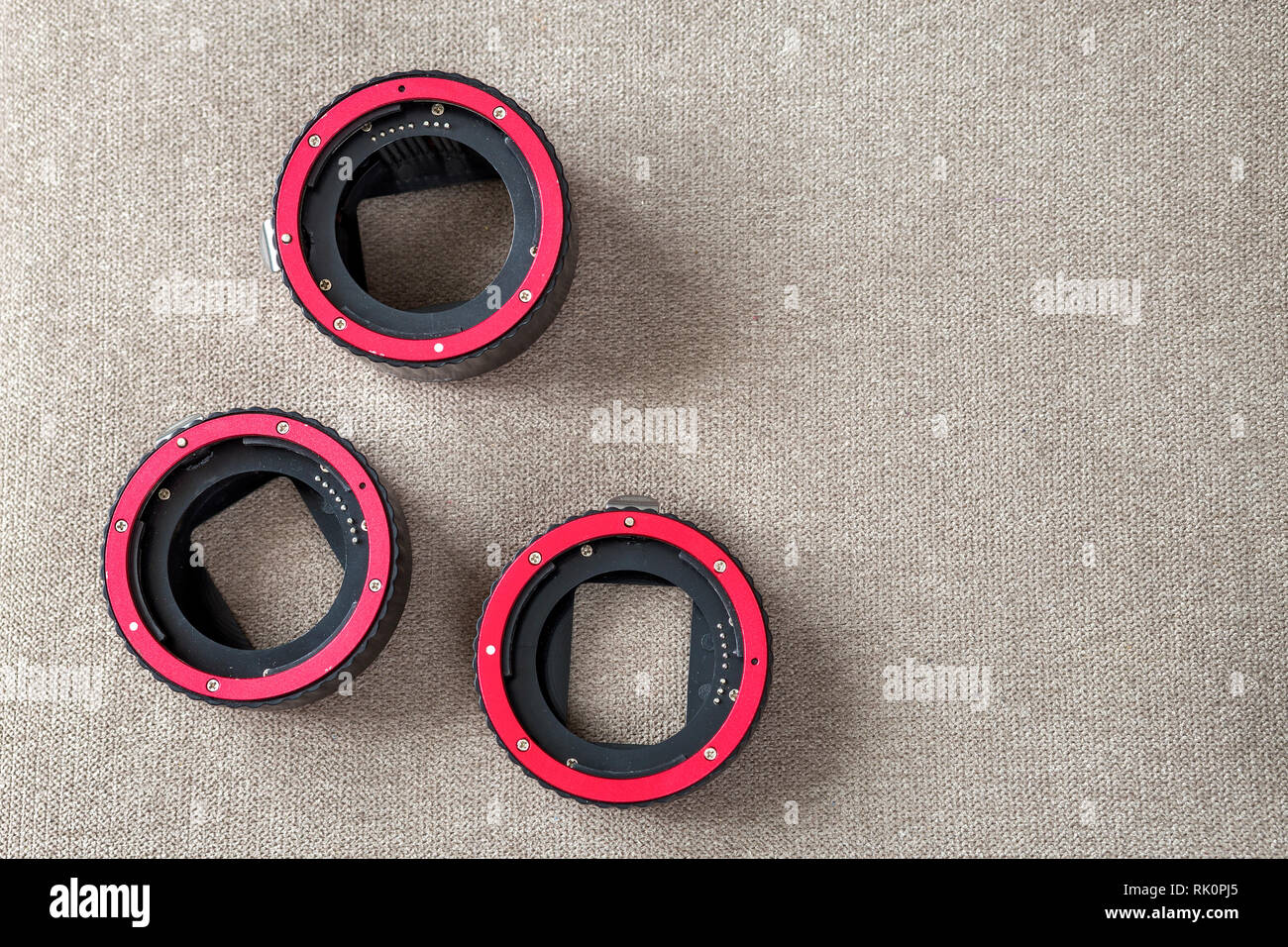 Close-up of macro rings, camera adapters on light cloth copy space ...