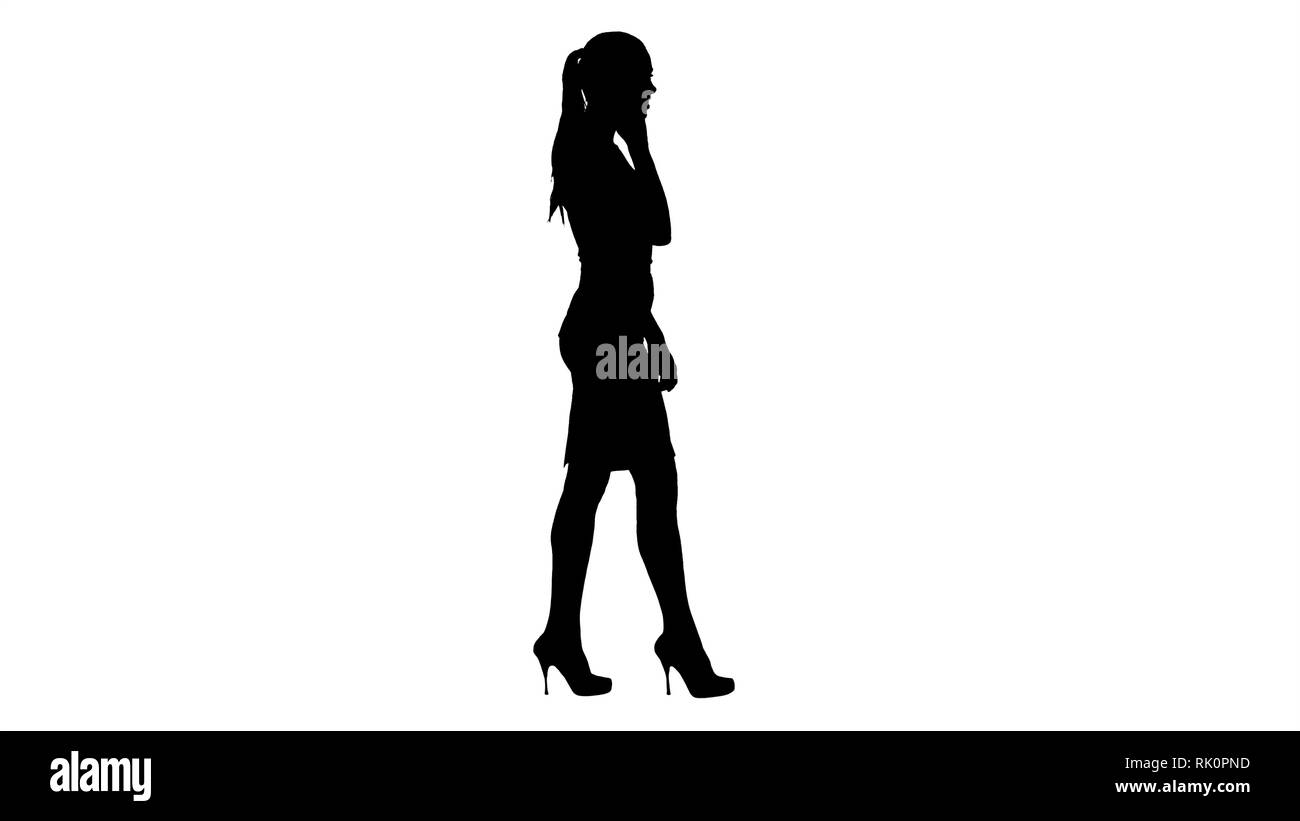 Silhouette Stylish businesswoman walking on meeting and calling to ...