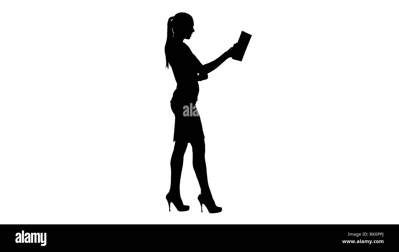 Silhouette Happy woman making a video call with tablet Stock Photo - Alamy