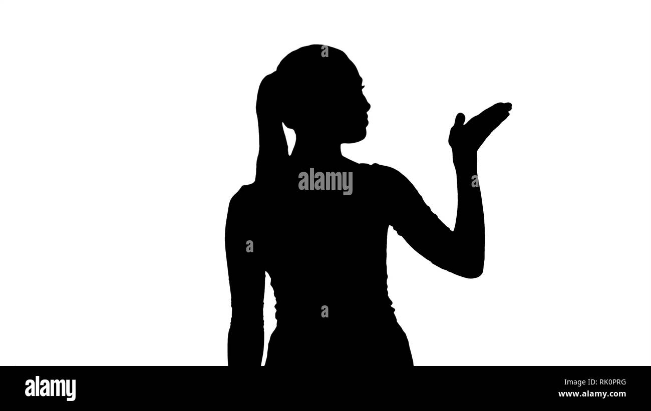 Silhouette Business woman presenter talking and showing product or text ...