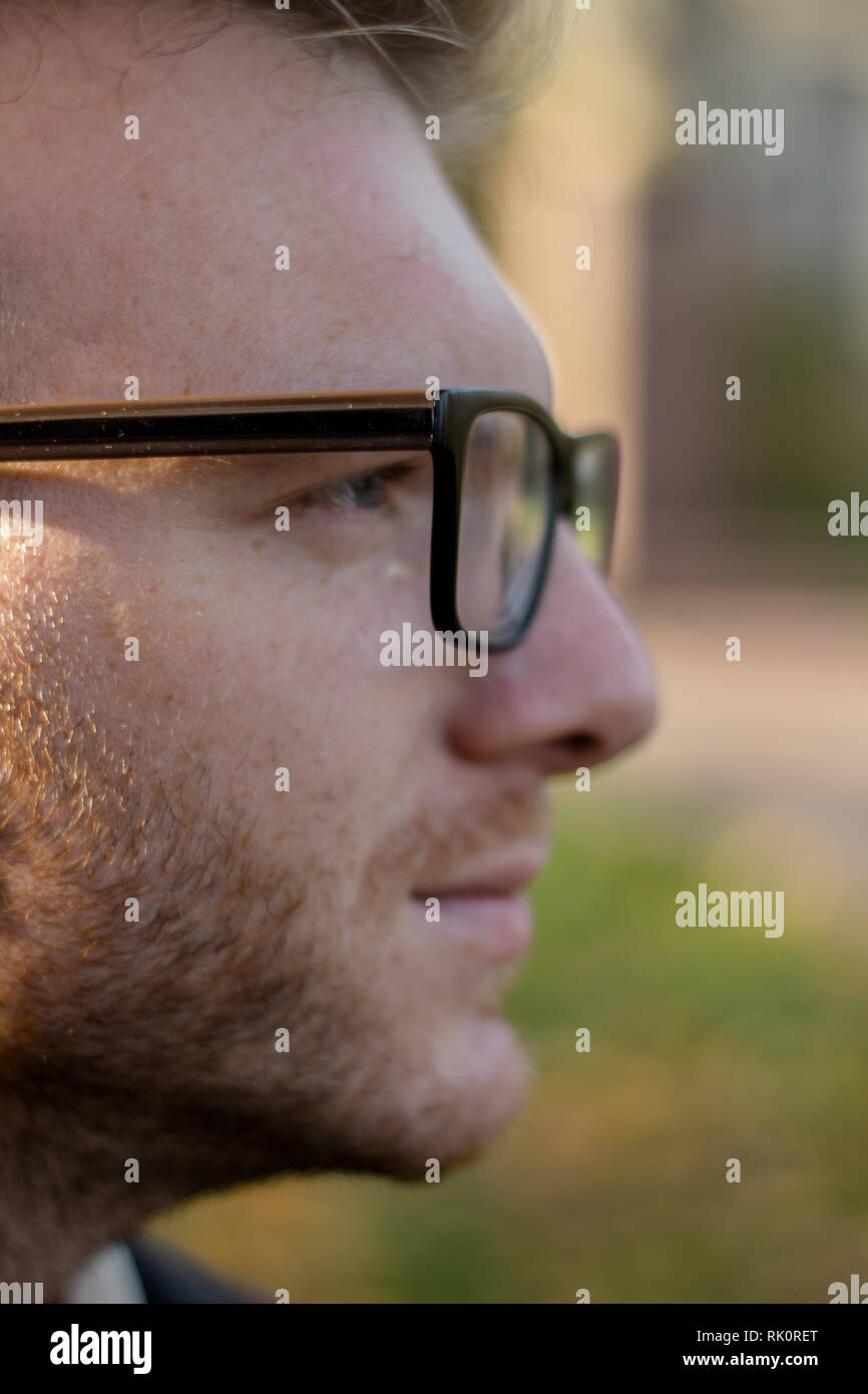 Portrait of a smart smiling guy looking straight Stock Photo - Alamy