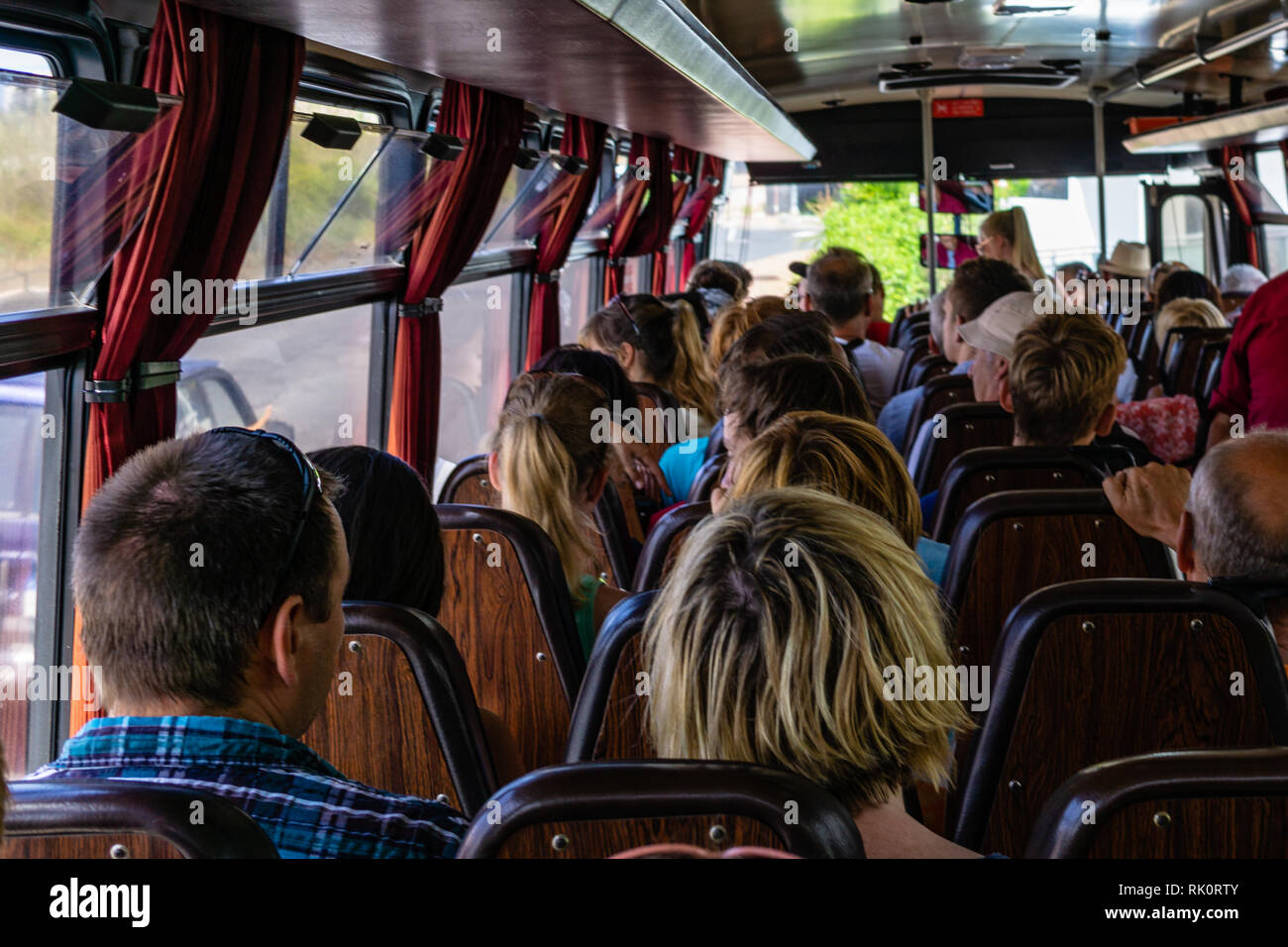 Funchal, Madeira - August 01, 2016: People sitting in a bus. View from ...