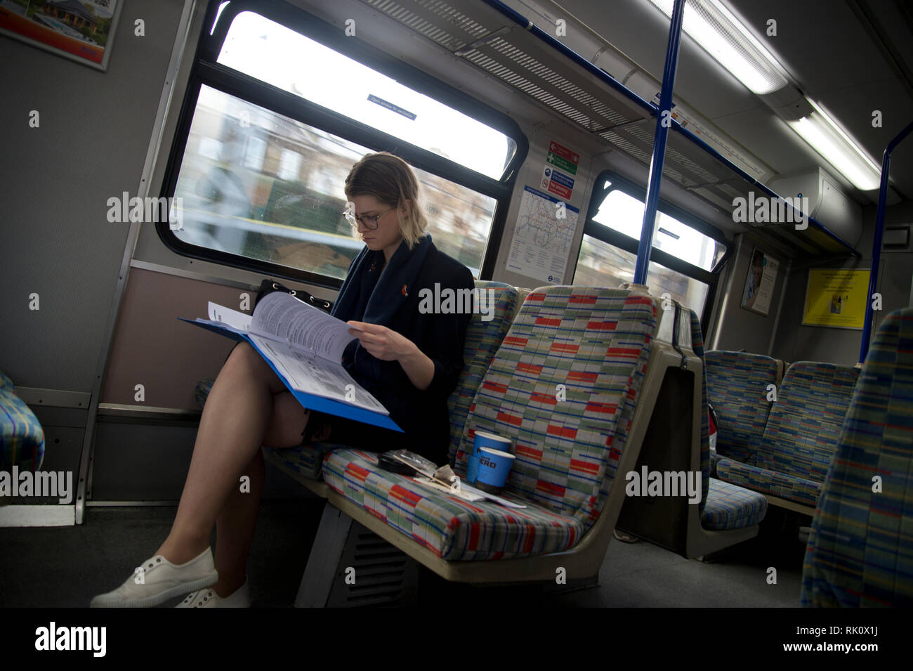 Working on train commuter woman hi-res stock photography and images - Alamy