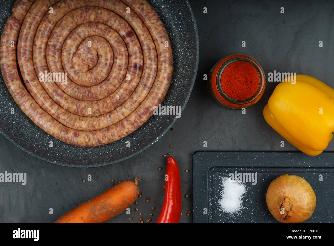 First page menu pork saussage with ingredients, raw food on dark desk ...