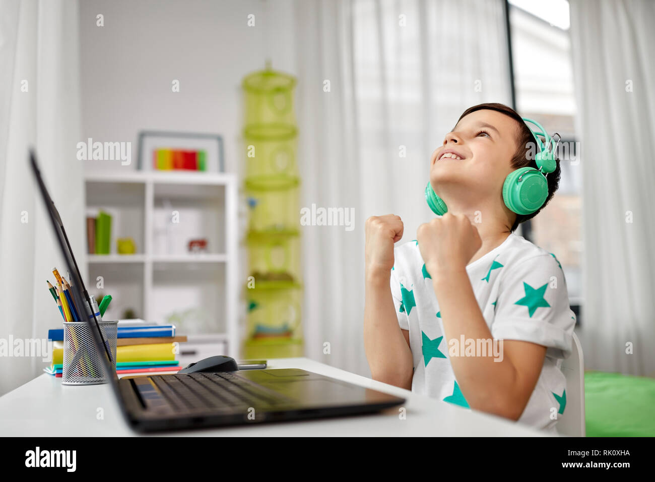 boy celebrating victory in computer video game Stock Photo - Alamy