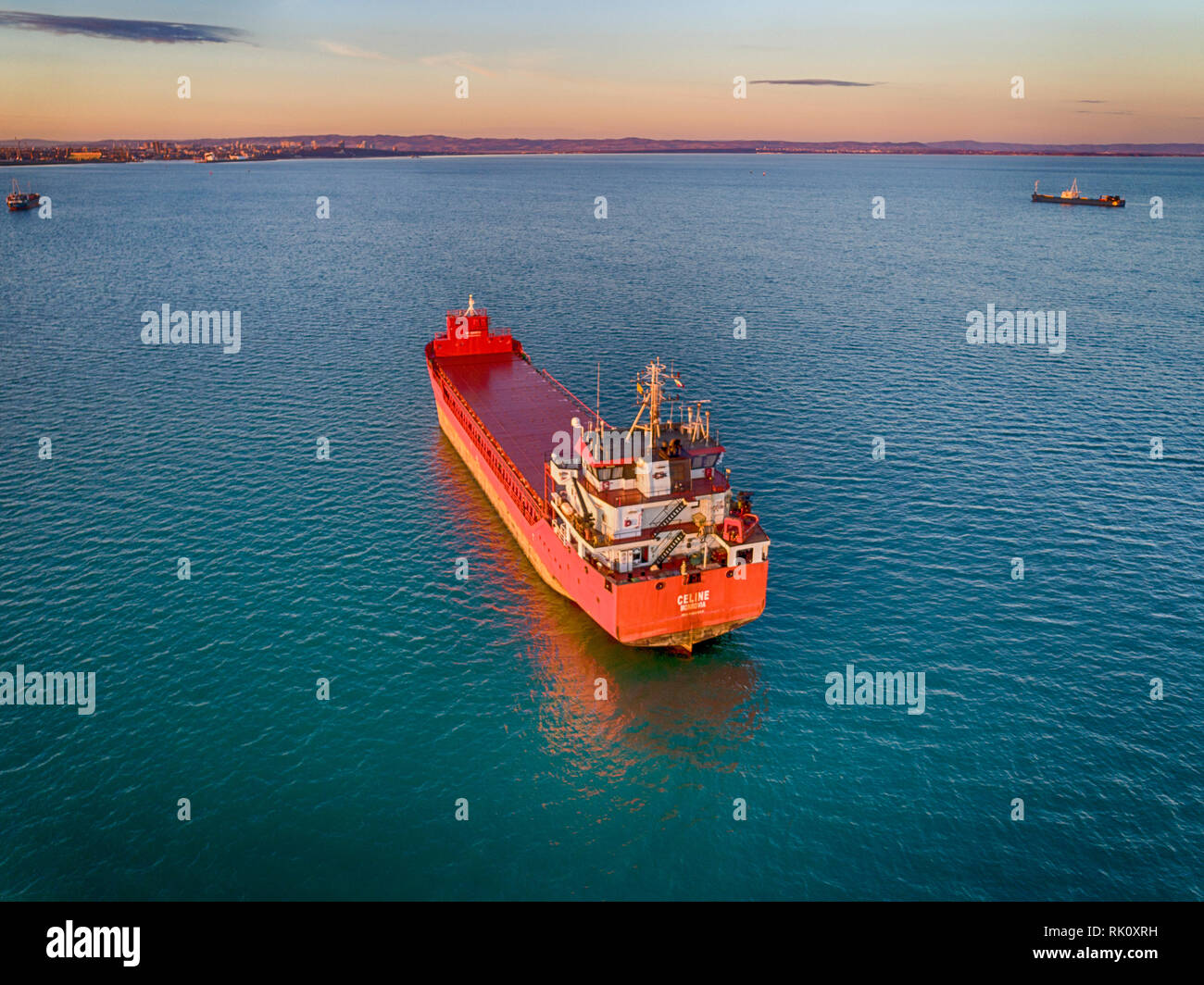 Aerial view of beautiful large ship at sunset. Colorful landscape with ...