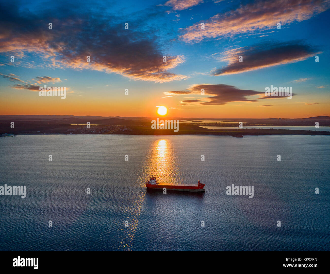 Aerial view of beautiful large ship at sunset. Colorful landscape with ...
