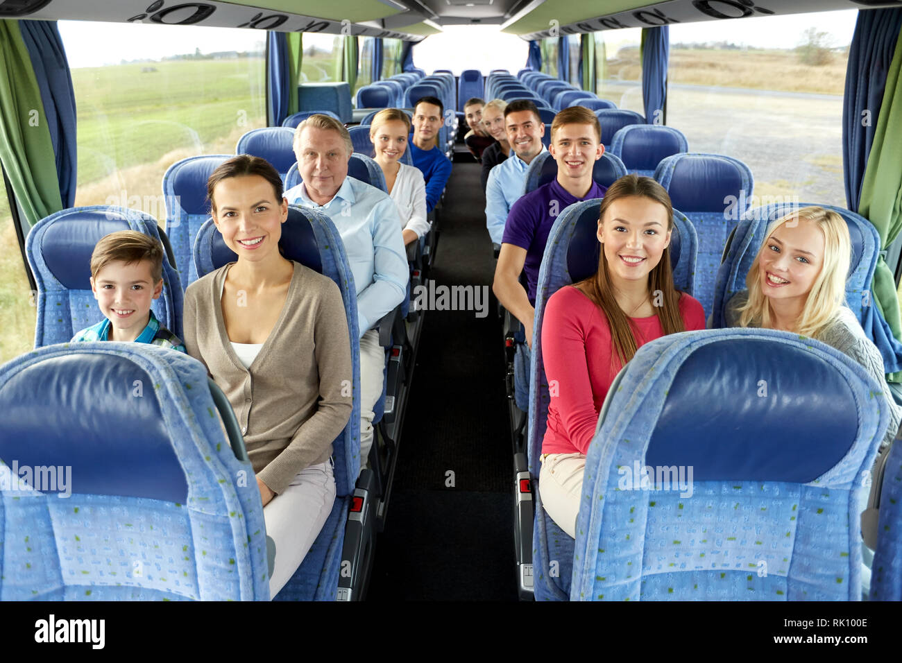 group of happy passengers travelling by bus Stock Photo - Alamy