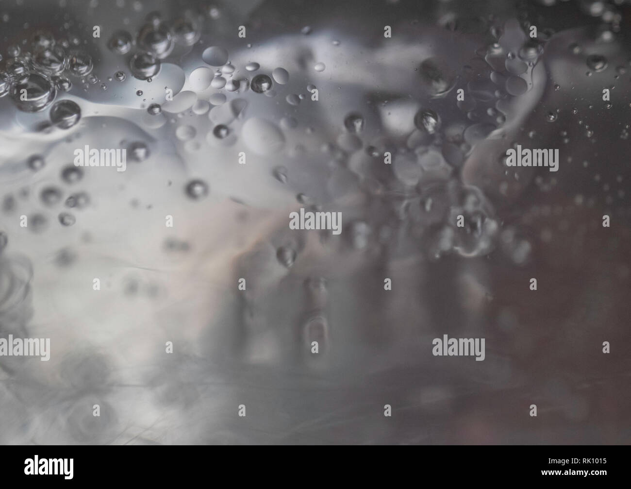 Boiling water in a pot, bubbles, abstract background. Global warming ...