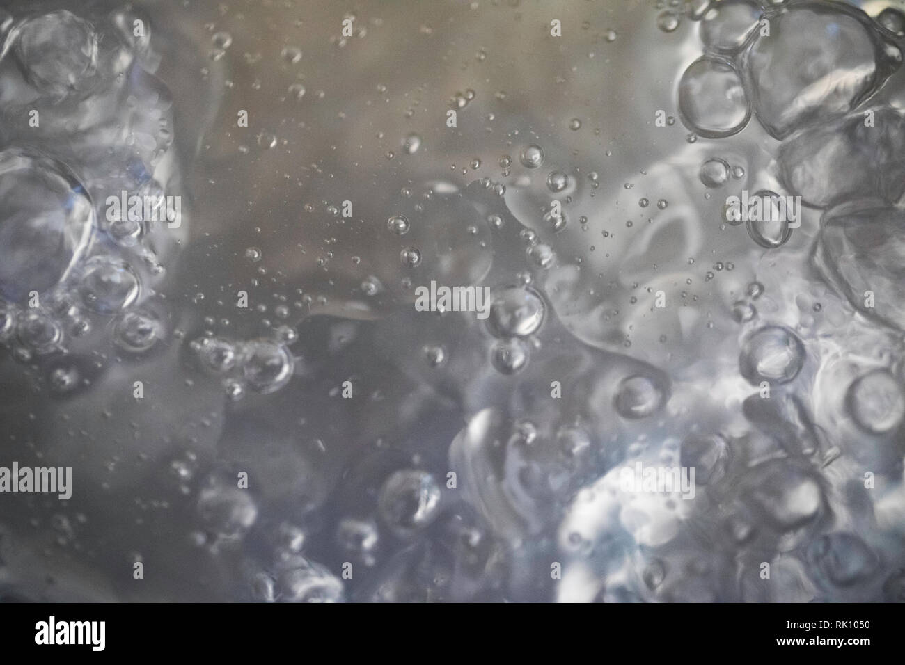 Boiling water in a pot, bubbles, abstract background. Global warming ...