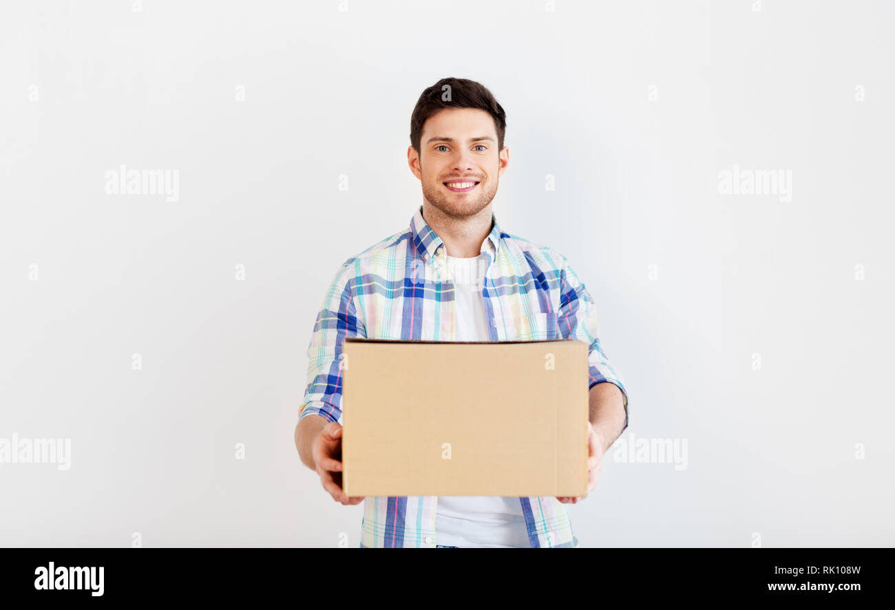happy man holding cardboard box Stock Photo - Alamy