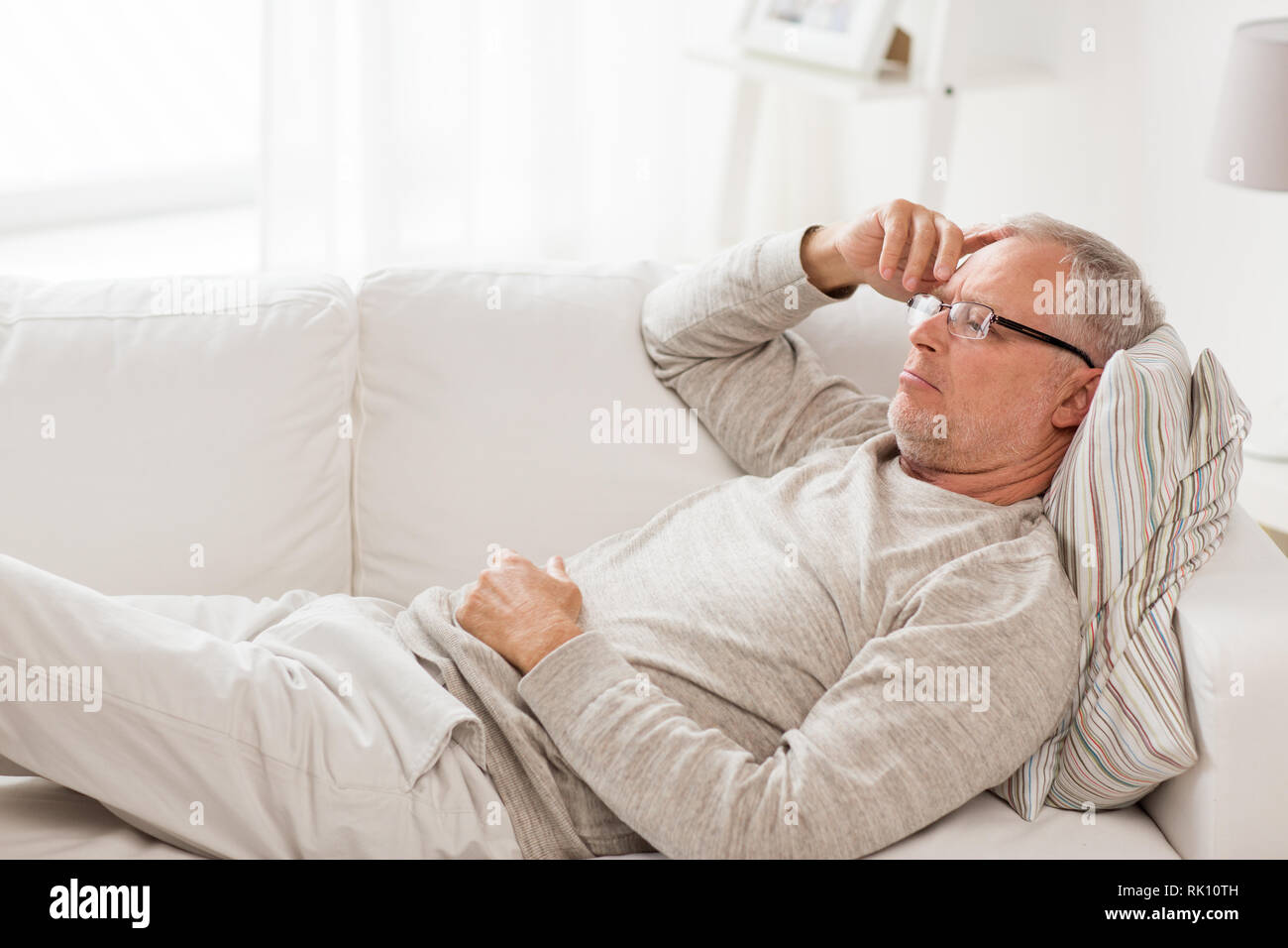 Man thinking serious sofa hi-res stock photography and images - Alamy