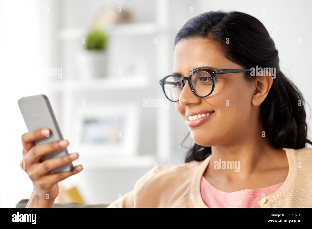 Indian using smartphone hi-res stock photography and images - Alamy