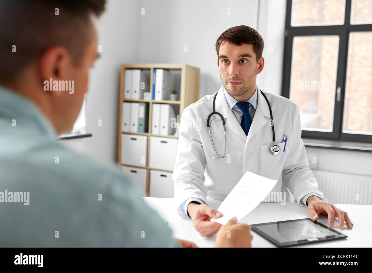 doctor giving prescription to patient at hospital Stock Photo - Alamy