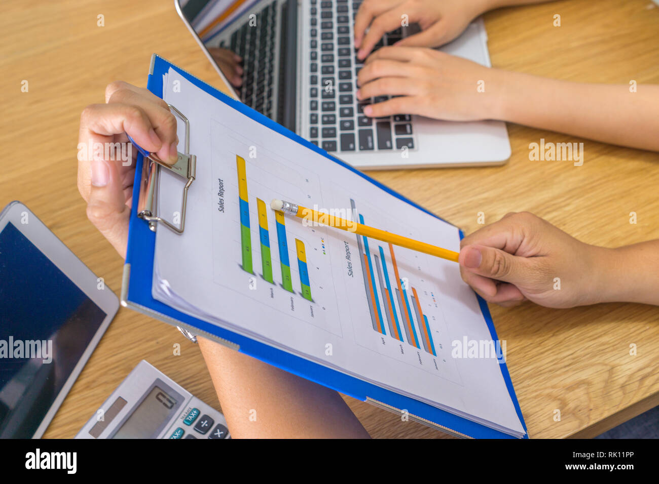 Hand pointing calculator pencil hi-res stock photography and images - Alamy