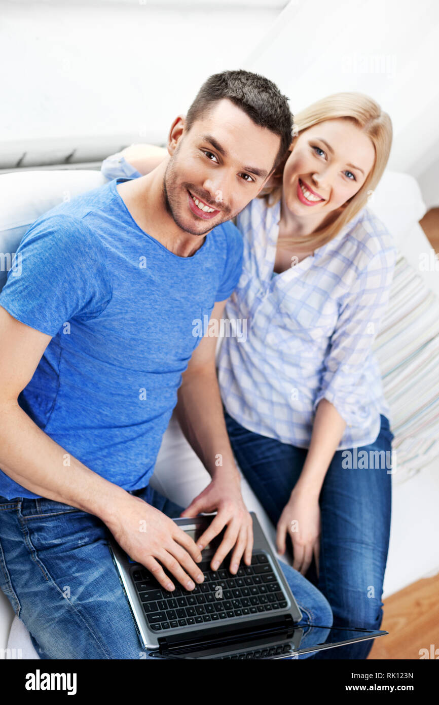 happy couple with laptop computer at home Stock Photo - Alamy