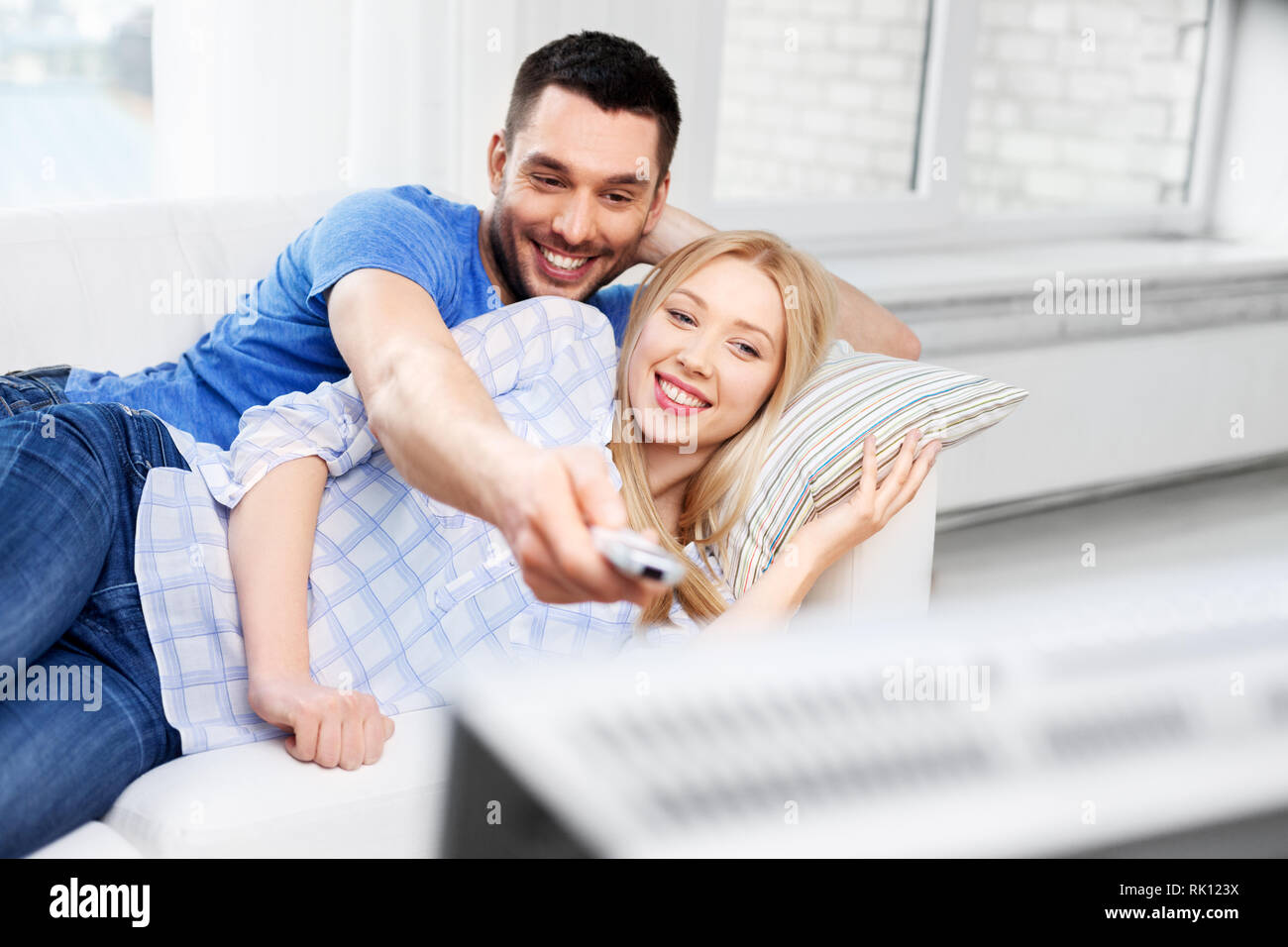 Happy woman home watching movie hi-res stock photography and images - Alamy