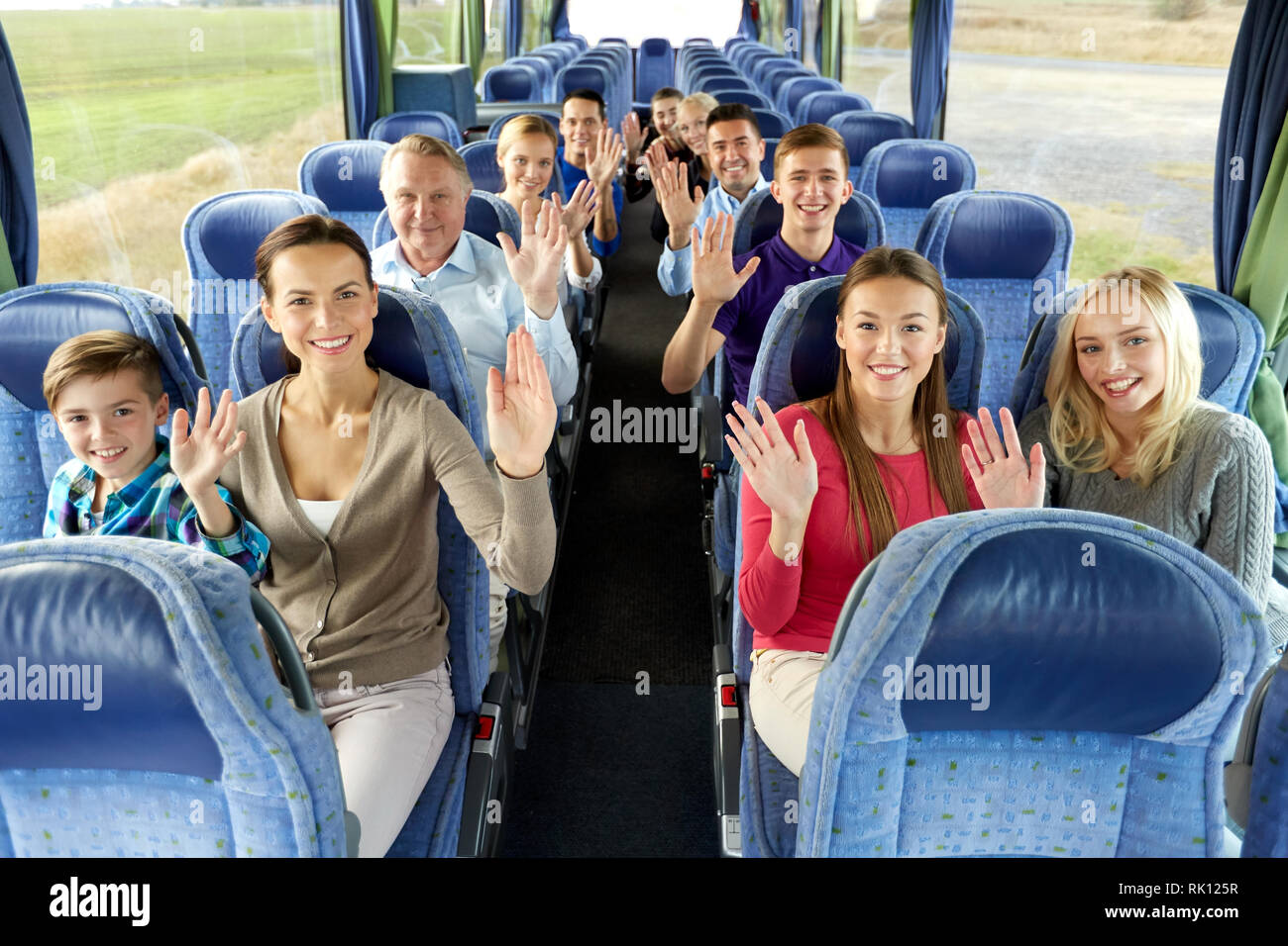 group of happy passengers travelling by bus Stock Photo - Alamy