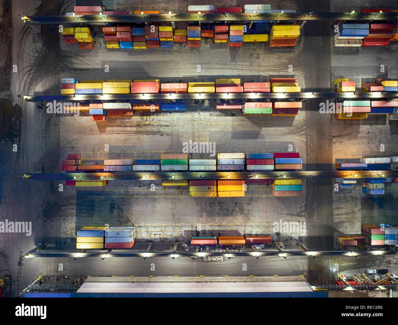 Aerial view container warehouse and working crane bridge loading ...