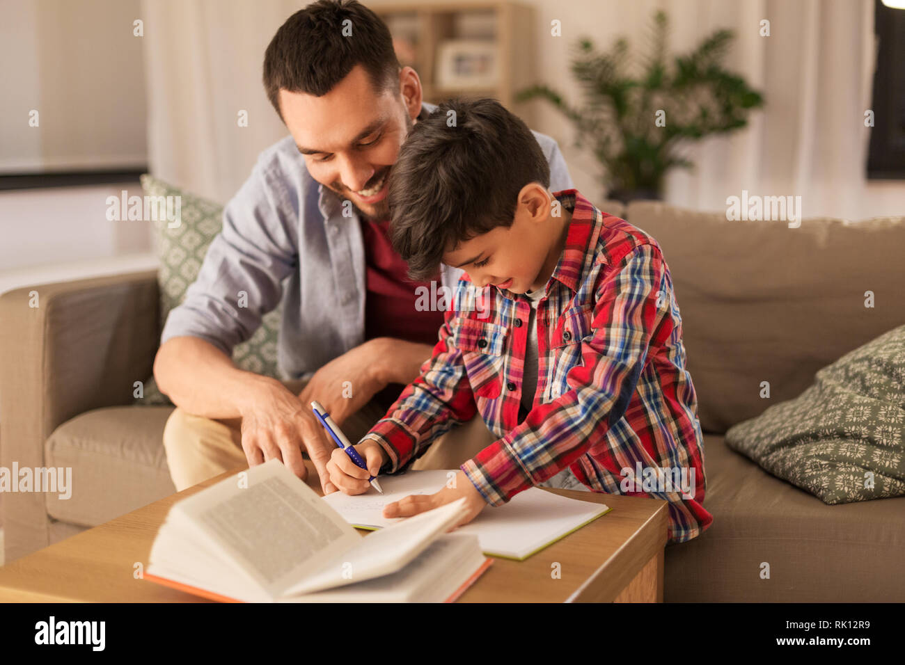 father and son doing homework together Stock Photo - Alamy