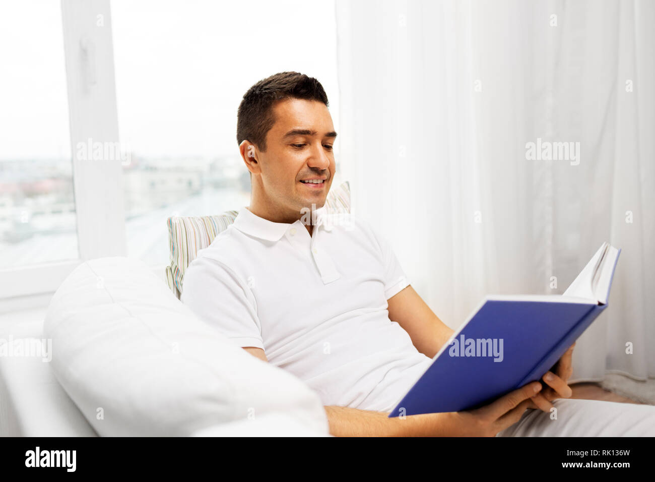 happy man reading book at home Stock Photo - Alamy happy man reading book at home Stock Photo - Alamy