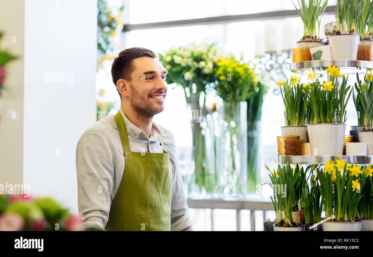 florist man or seller at flower shop counter Stock Photo - Alamy