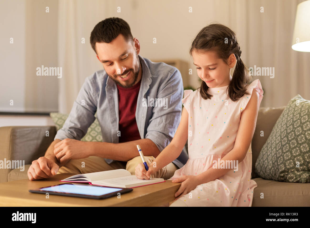 father and daughter doing homework together Stock Photo - Alamy