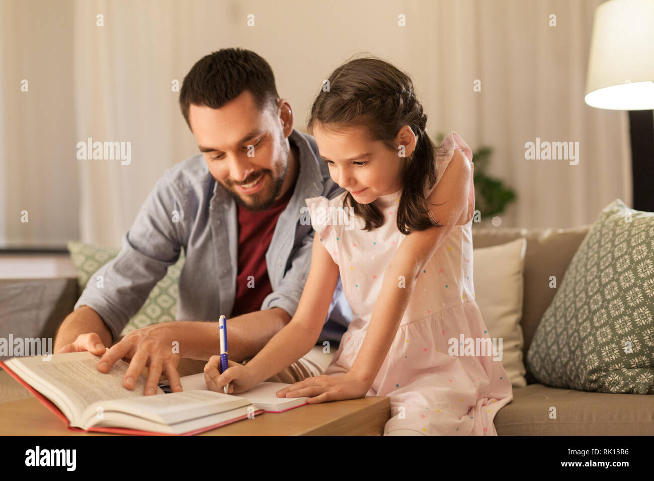 father and daughter doing homework together Stock Photo - Alamy