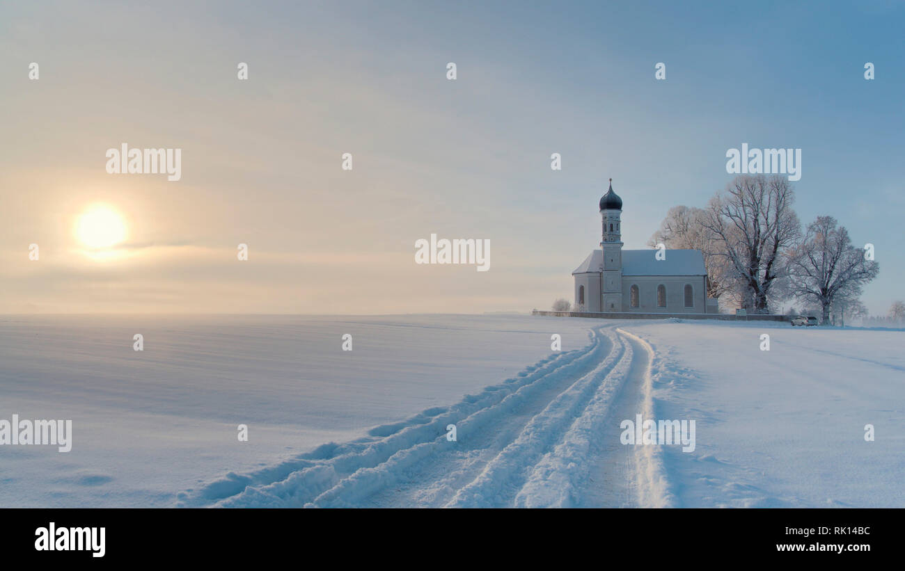 Winter landscape with isolated church Stock Photo - Alamy