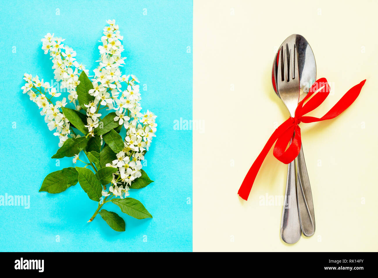 Spring flowers and cutlery. Minimal easter concept. Flat lay, top view ...