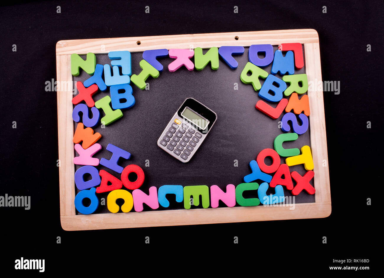 Calculator and Colorful Letters of Alphabet made of wood Stock Photo ...