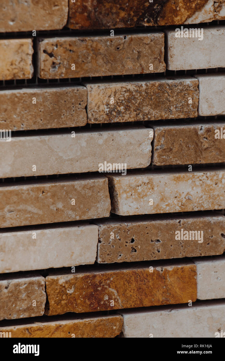 Decorative stone background built of little stones Stock Photo - Alamy