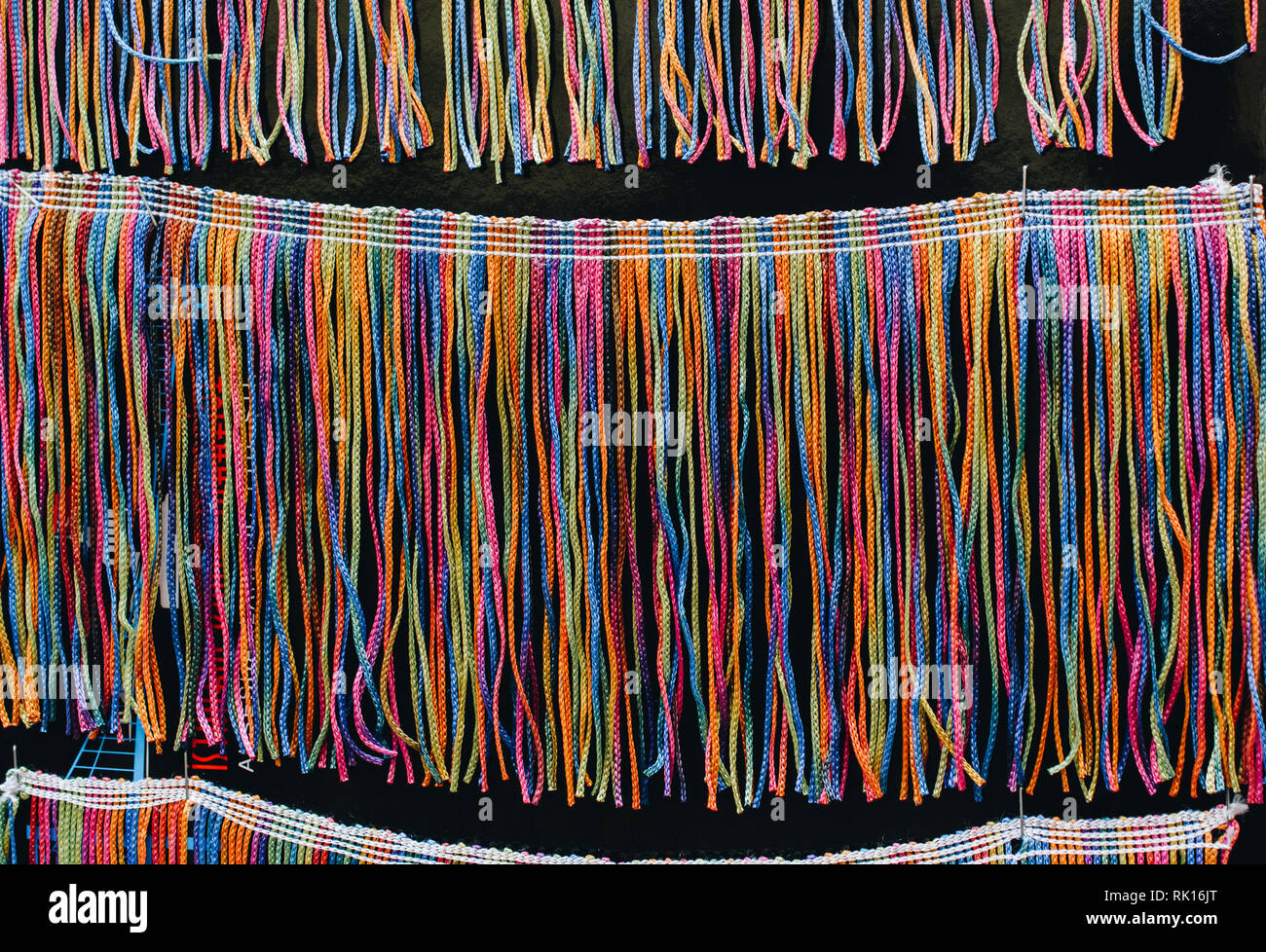 Lots of colorful braided strings in the view Stock Photo - Alamy