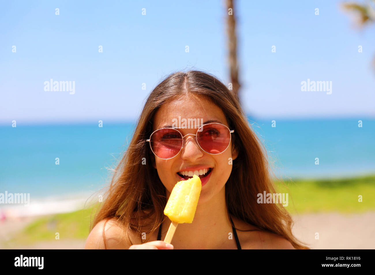 Girl eating popsicle ice cream High Resolution Stock Photography and ...