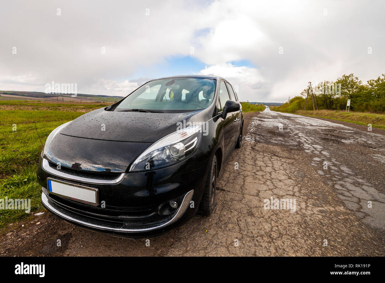 Close-up picture of a modern car on a bad road Stock Photo - Alamy