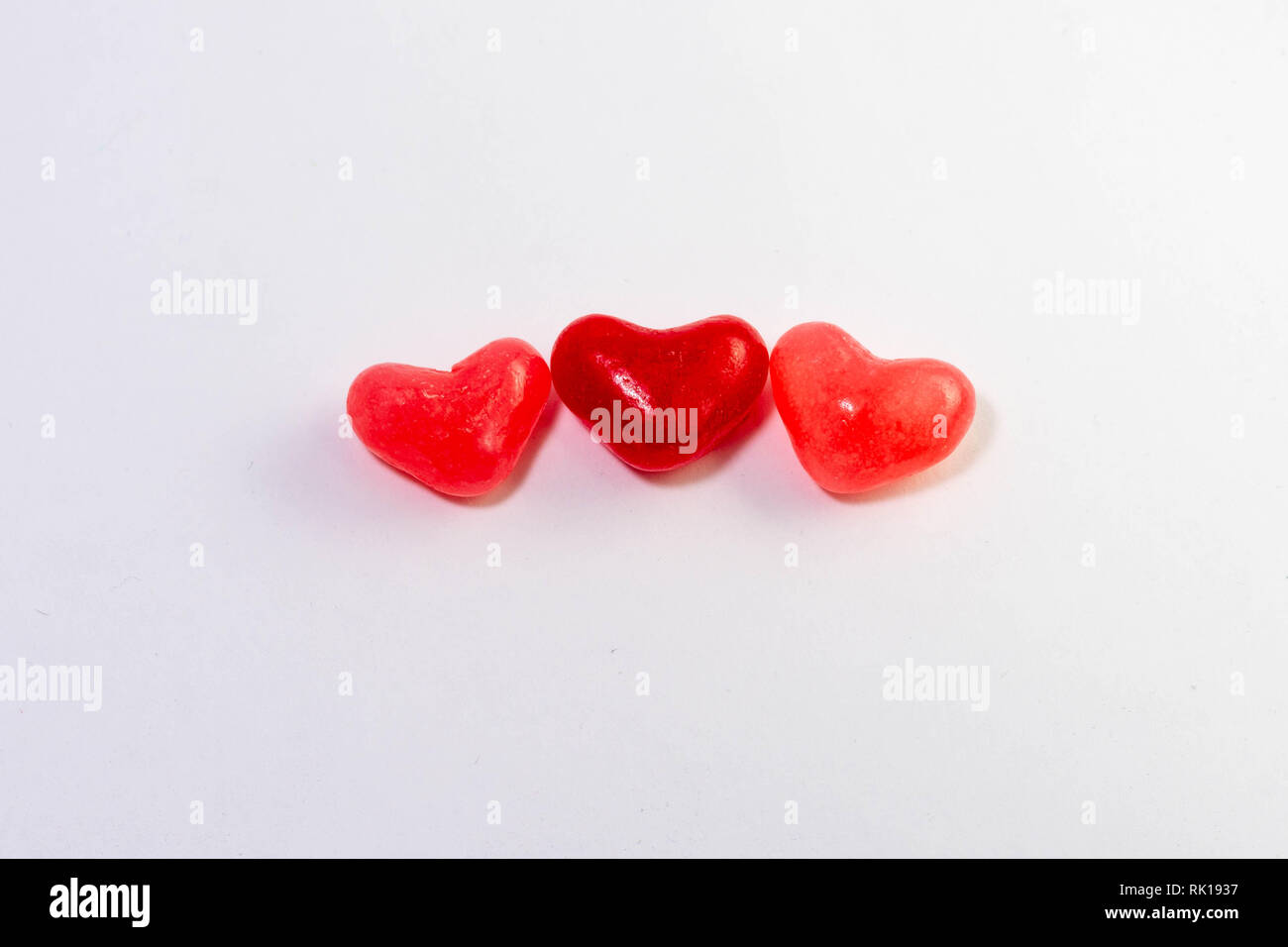 Three candy love Stock Photo - Alamy