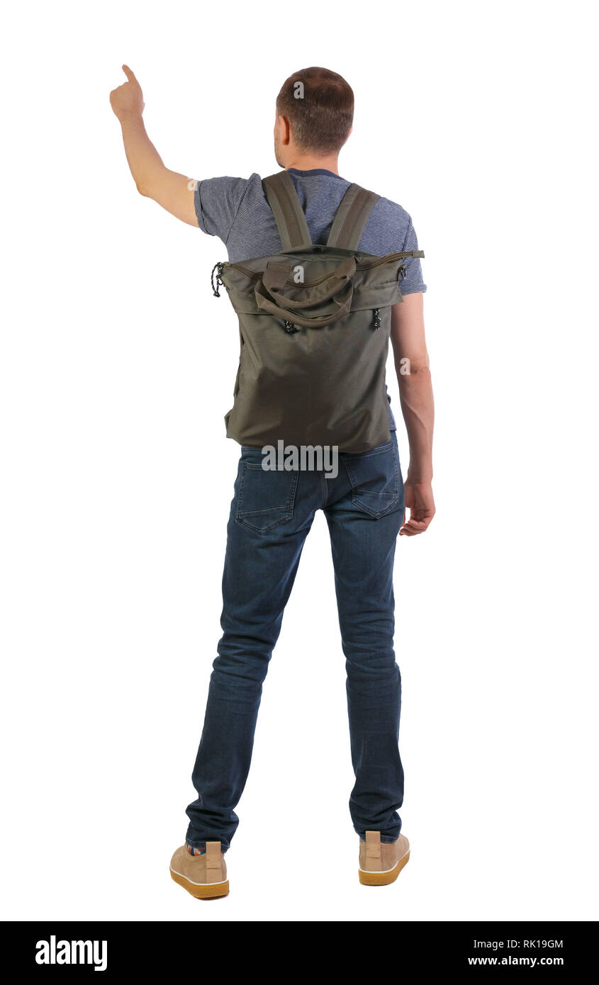 Back view of a man with a green backpack pointing forward. backside ...