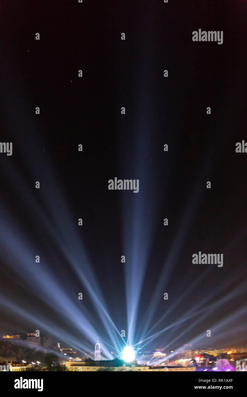 Alien spaceship landing in a city enviroment. UFO concept with bright ...