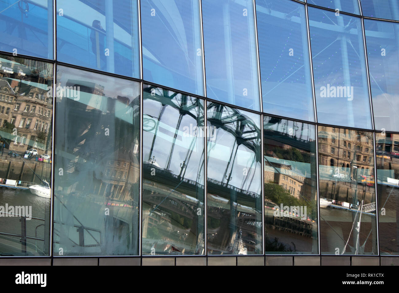 Reflections of the Tyne Bridge and Georgian river front buildings on ...