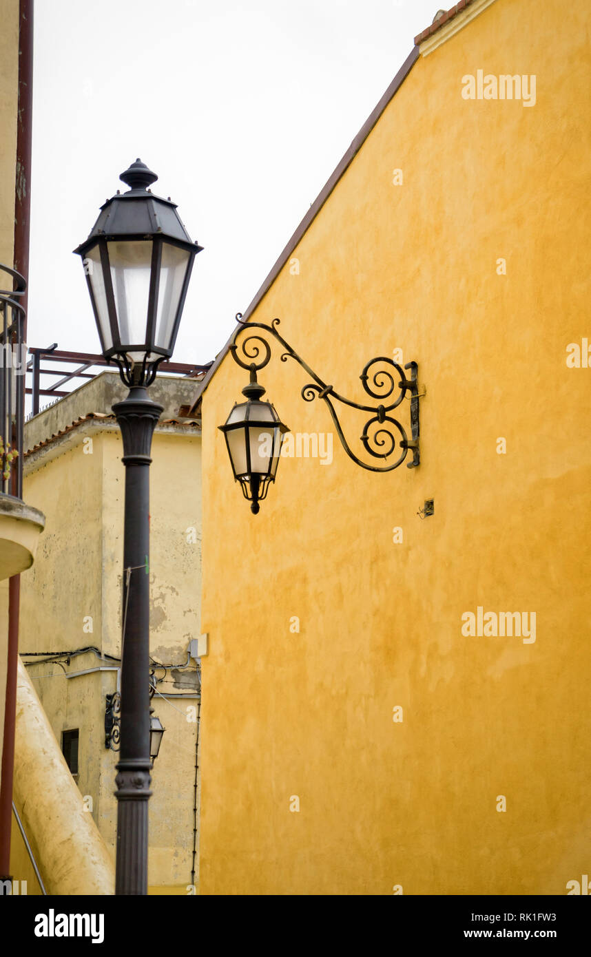 Traditional mediterranean alley with street lamp Stock Photo - Alamy