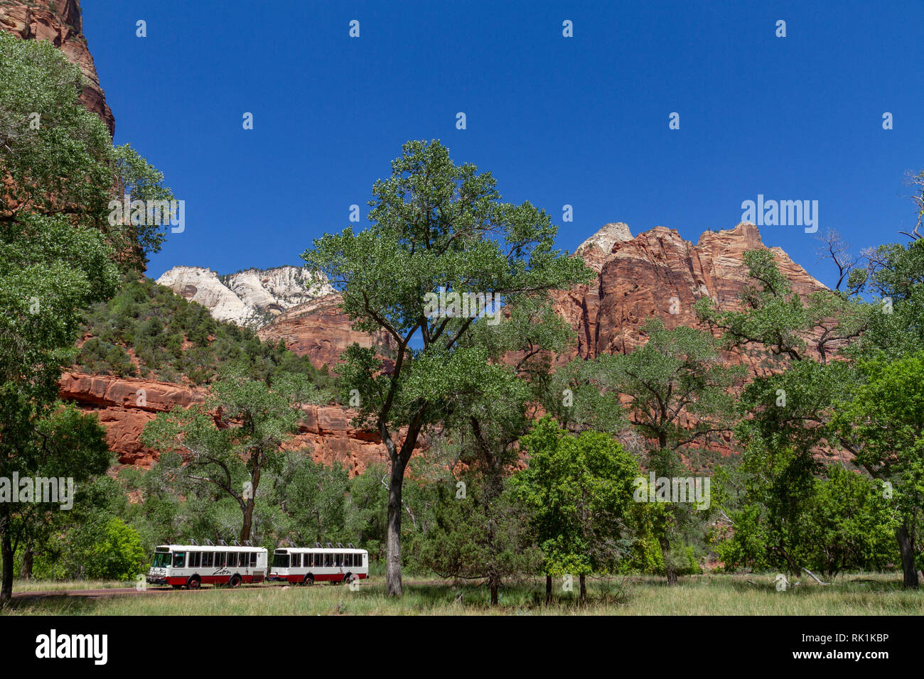 Zion Park shuttle bus passing thought the stunning scenery of Zion ...