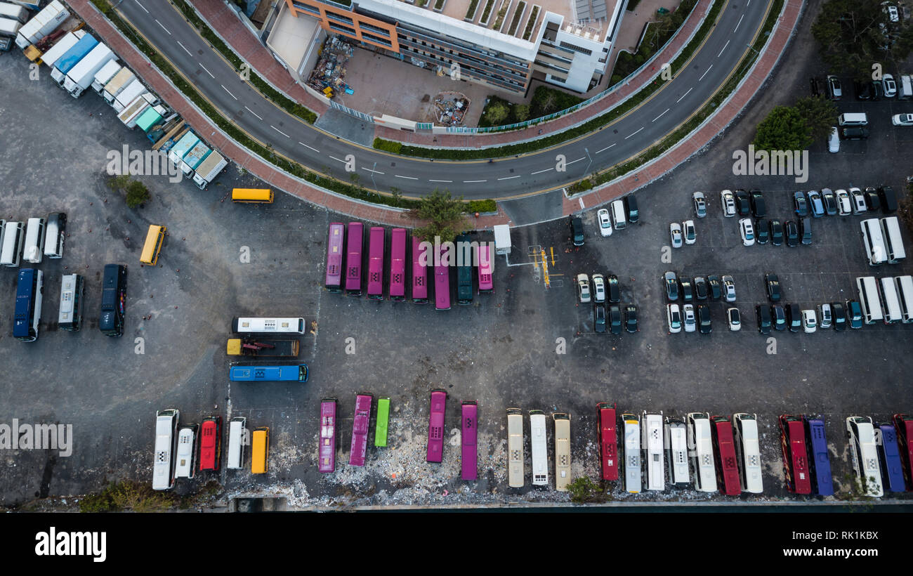 Multi-colored buses parked in an open air parking near Hung Hom Stock ...