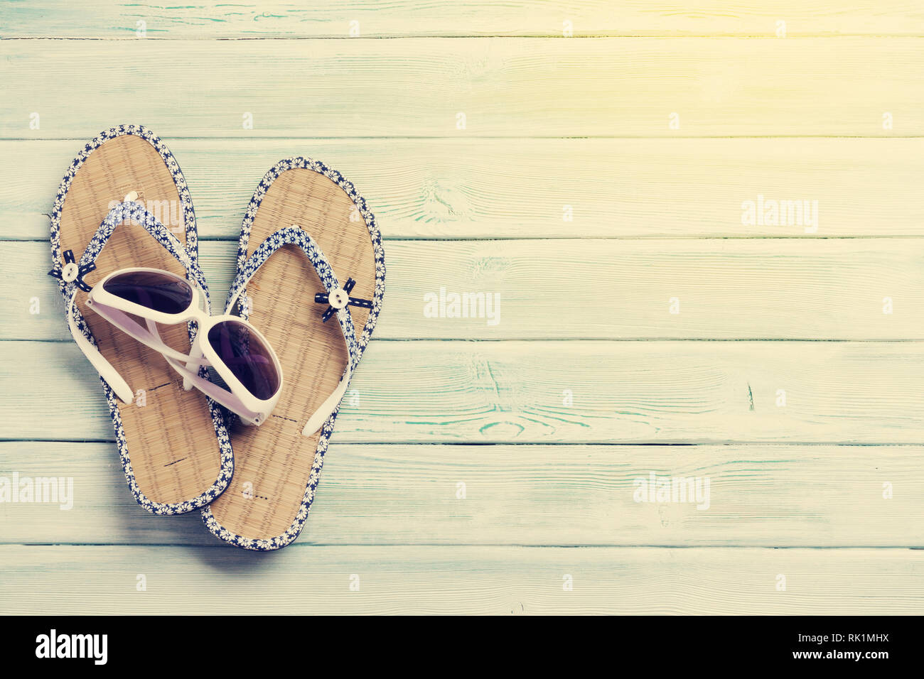 Travel vacation background concept with sunglasses and flip flops on ...