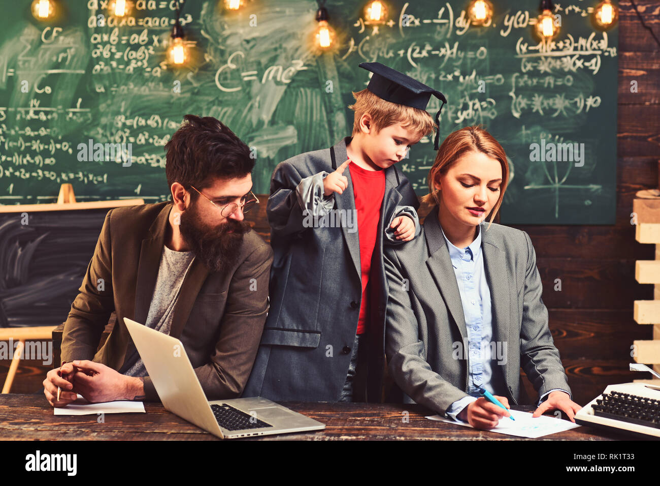 Couple and child play school together, teaching and learning Stock ...