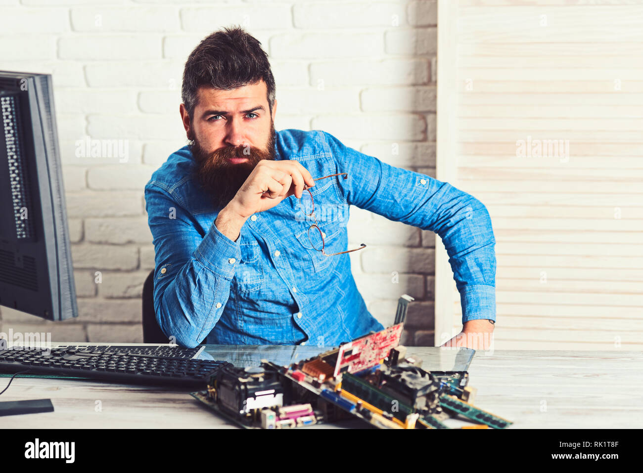 Confident in his skills. Engineer or technician at work. Bearded ...