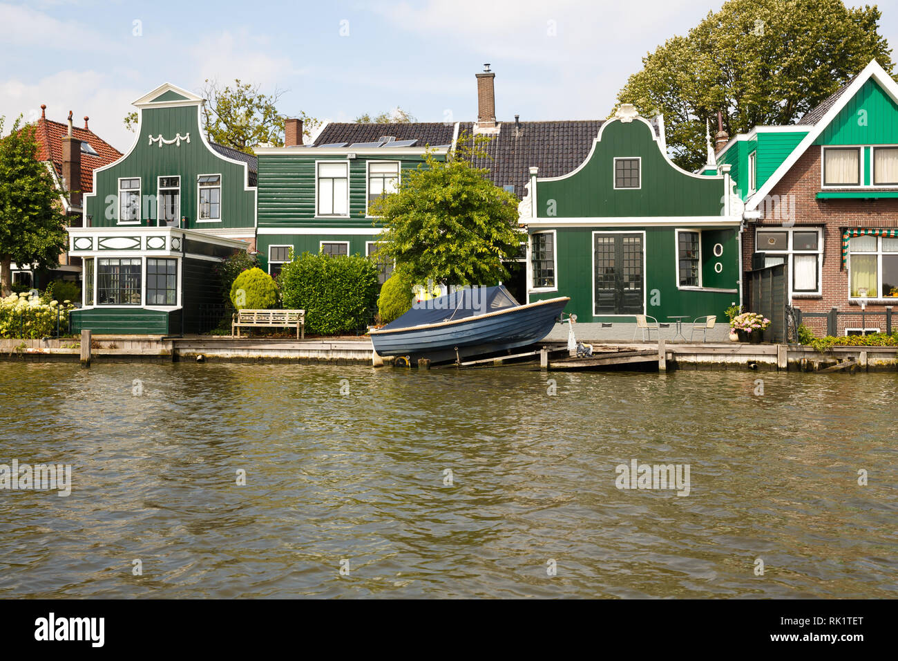 Traditional, authentic dutch houses and boat at the canal Stock Photo ...