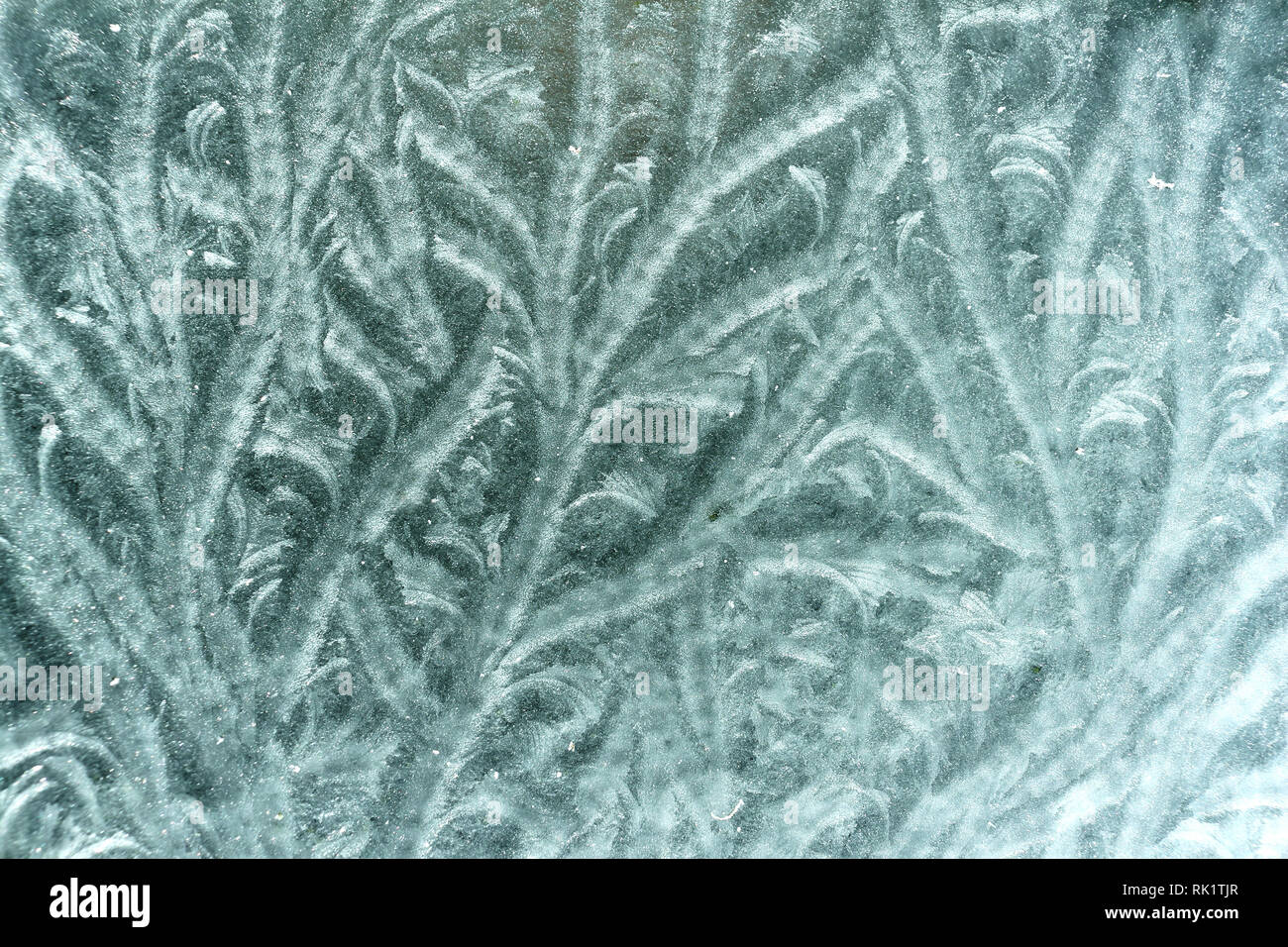 Natural pattern formed by frost on an outside glass table top Stock ...