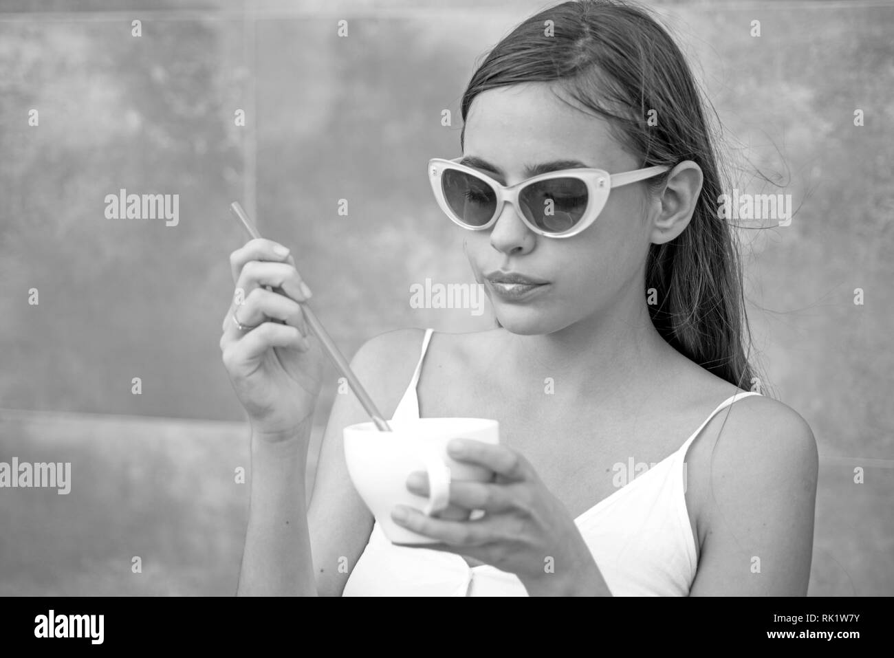 Woman drinking water through straw hi-res stock photography and images - Alamy
