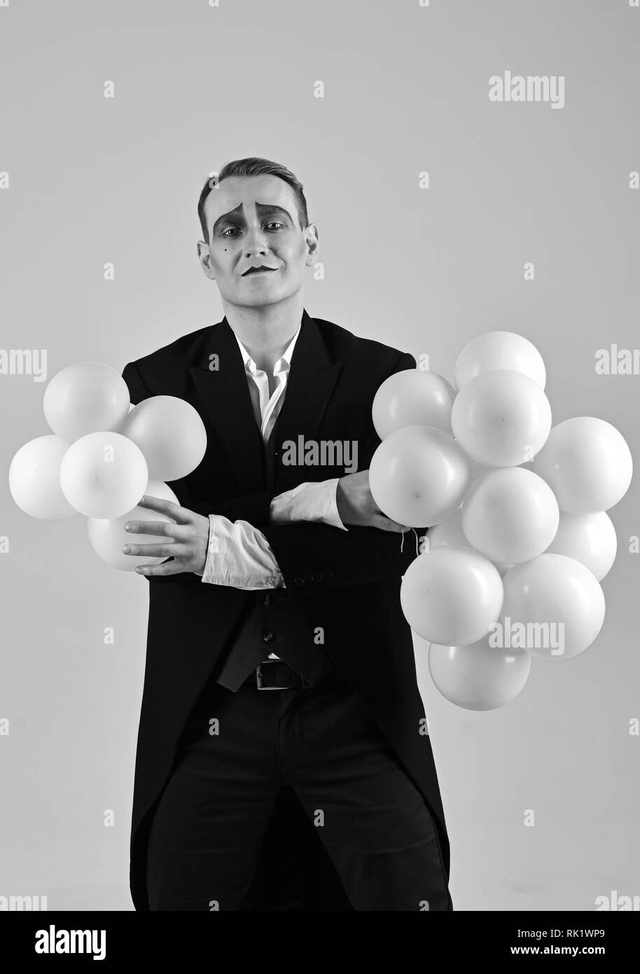 A joy that never ends. Balloon artist. Mime man with party balloons ...