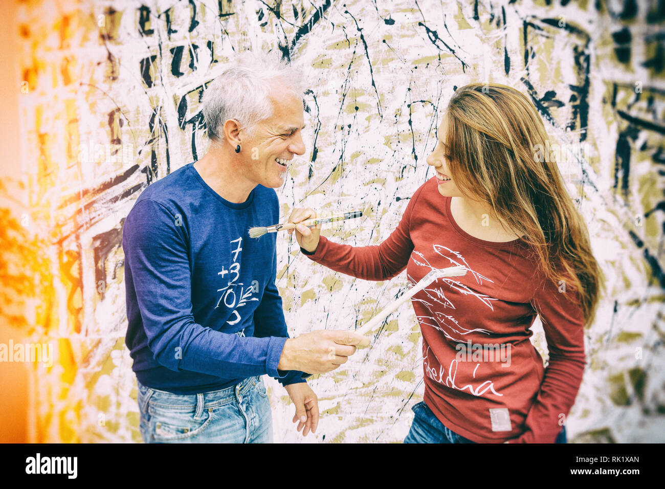 Two people posing Stock Photo - Alamy